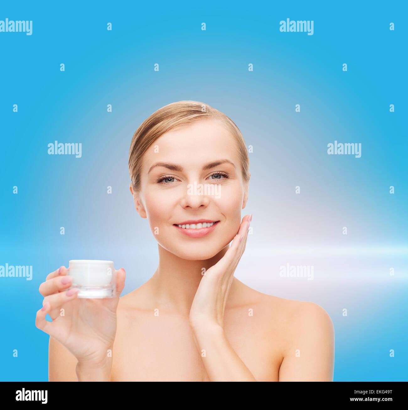 woman applying cream on her skin Stock Photo - Alamy