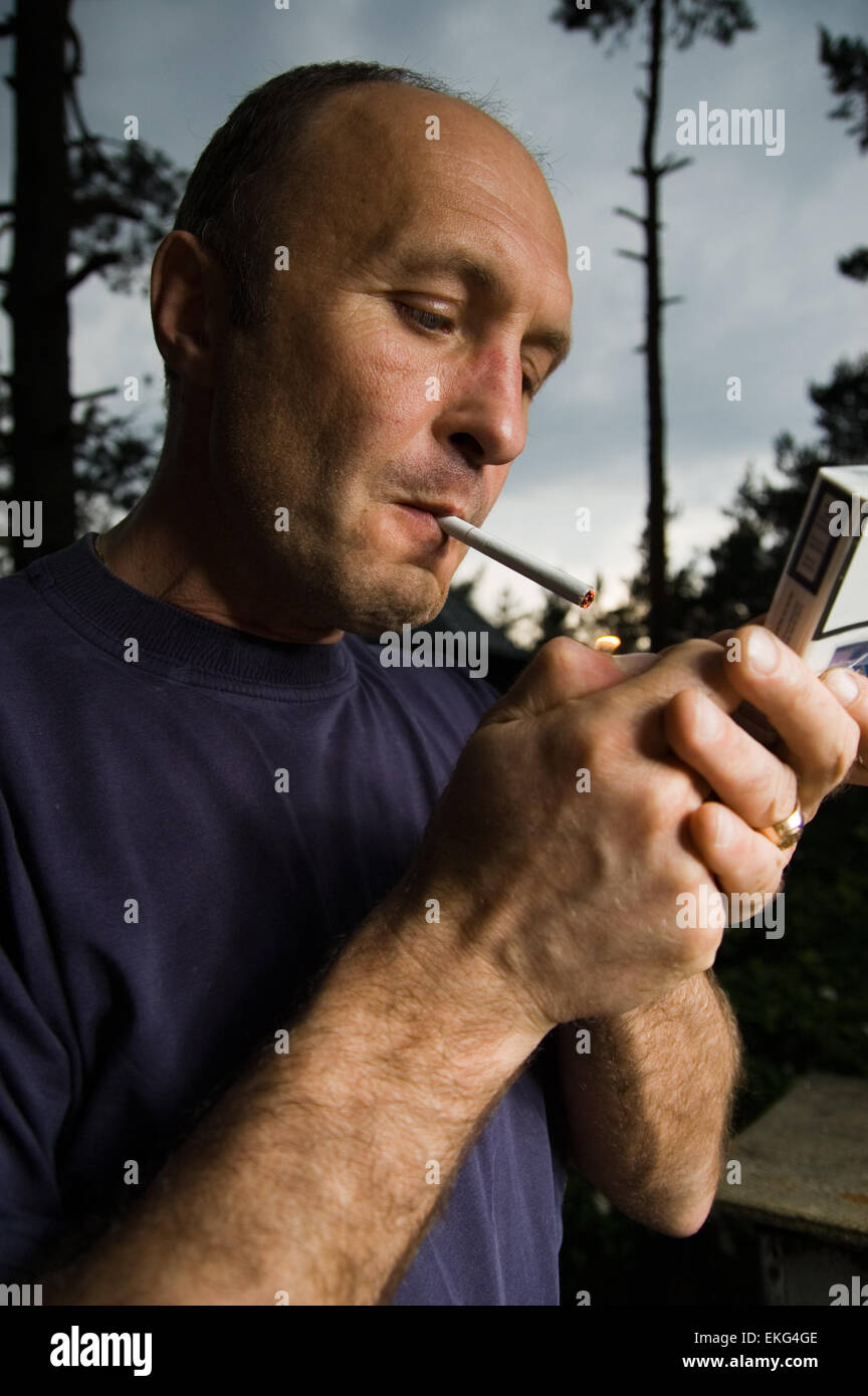 Smoker with a cigarette pack Stock Photo - Alamy
