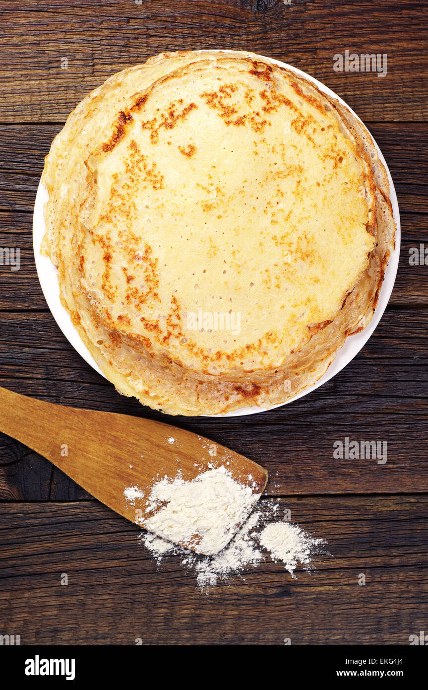 Stack of delicious pancakes on old wooden table. Top view Stock Photo ...