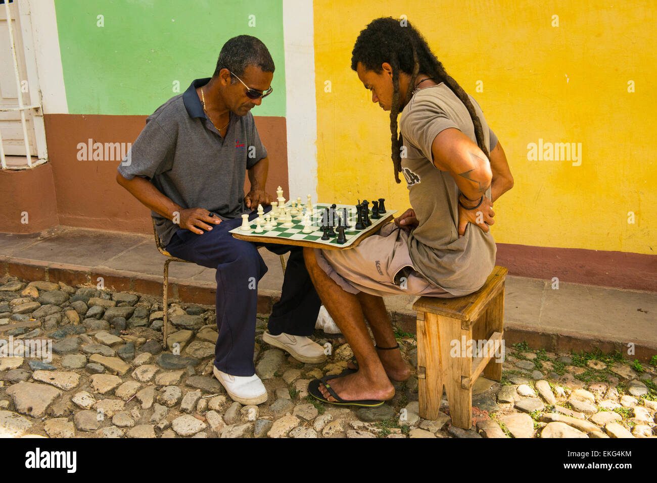 Cuba Trinidad street cobbles cobbled two men play chess on road ...