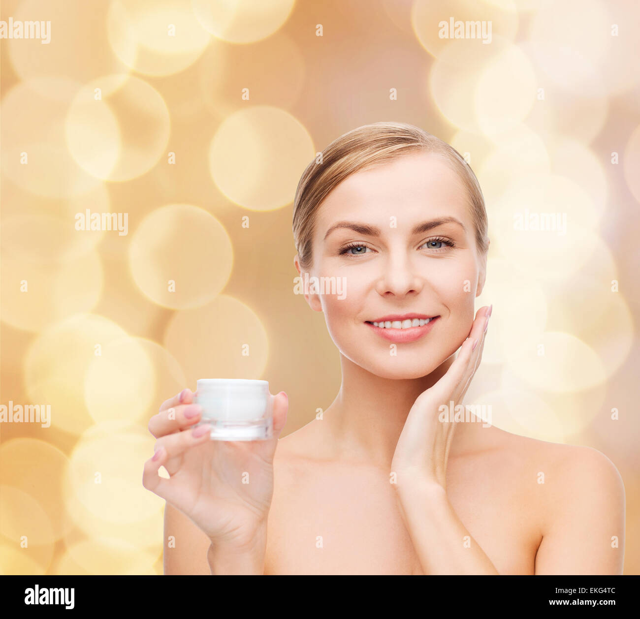 woman applying cream on her skin Stock Photo - Alamy