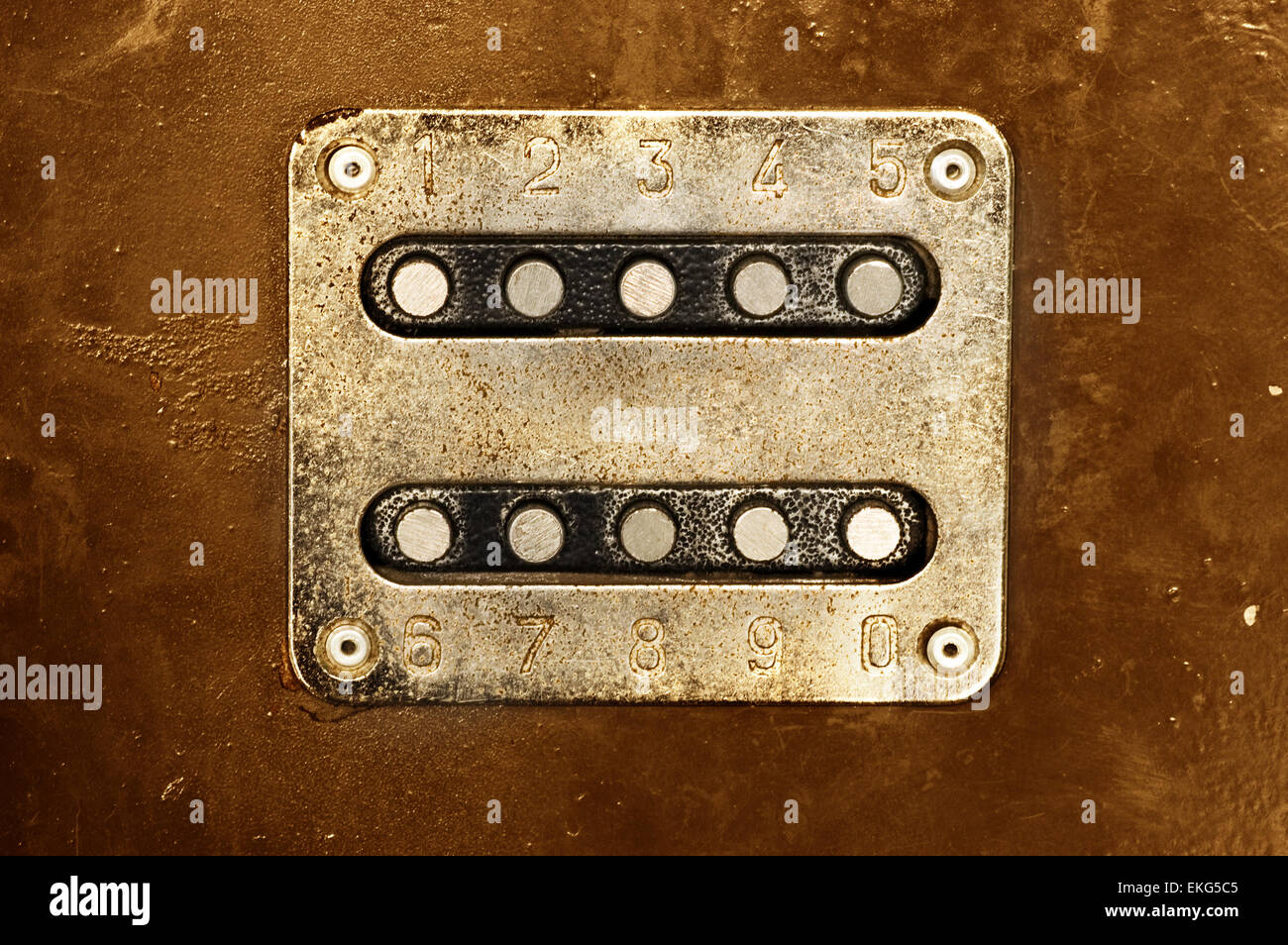 Rusty metal panel with buttons and numbers Stock Photo - Alamy