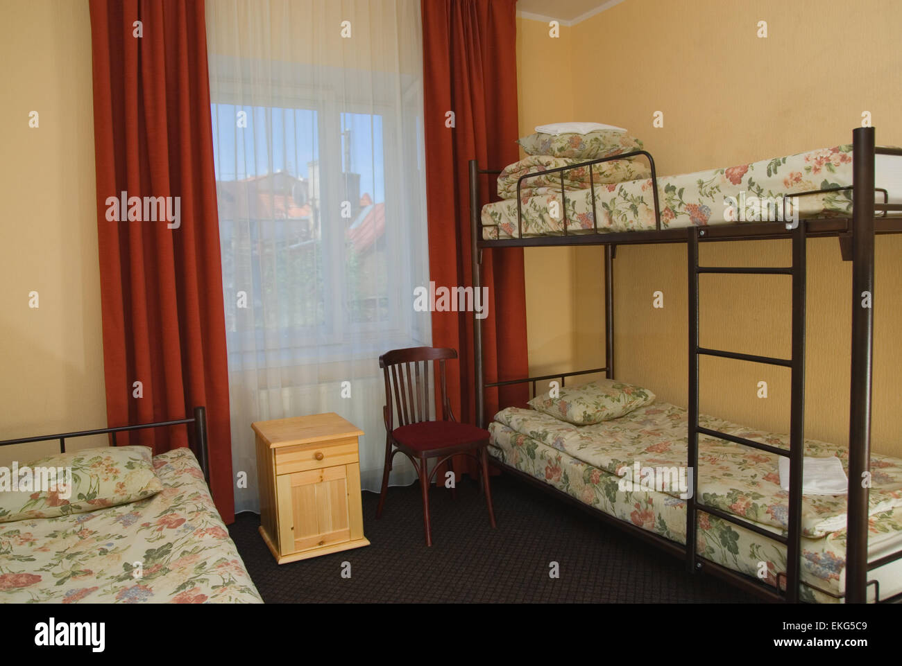 Hostel room with city view Stock Photo - Alamy