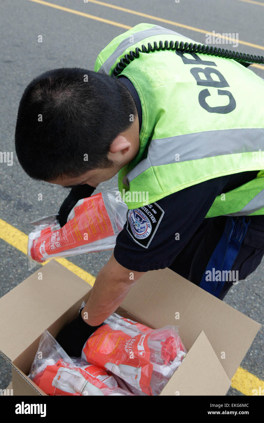 CBP officers in Seattle inspect vehicles at the port of entry, checking ...