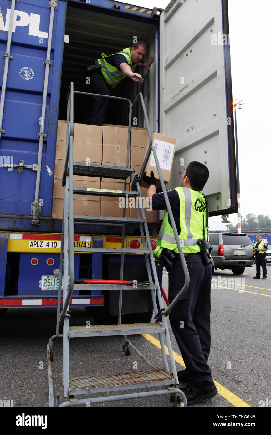 US Customs and Border Protection Field Officers conduct inspection of ...