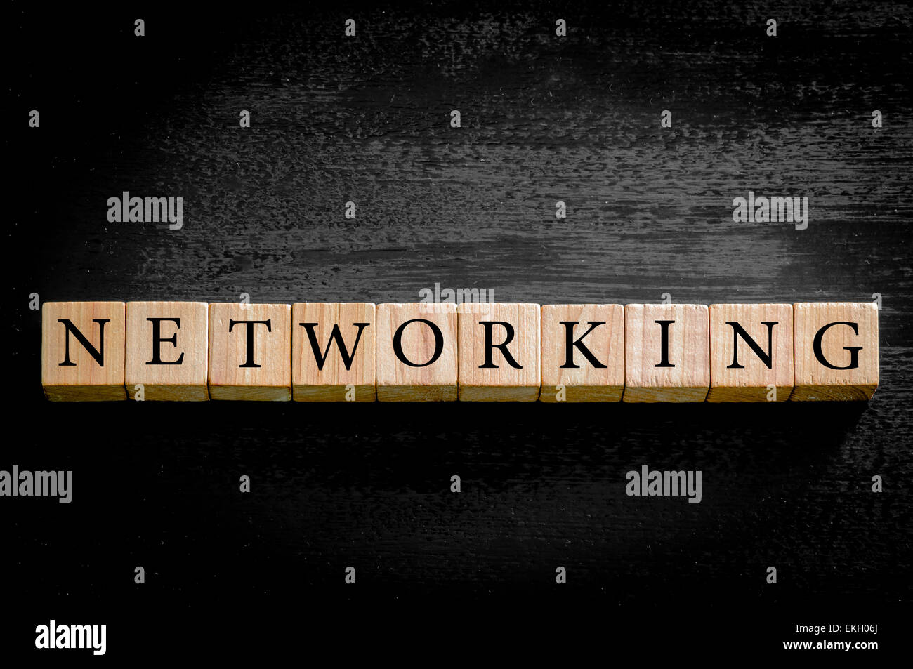Word NETWORKING. Wooden small cubes with letters isolated on black ...