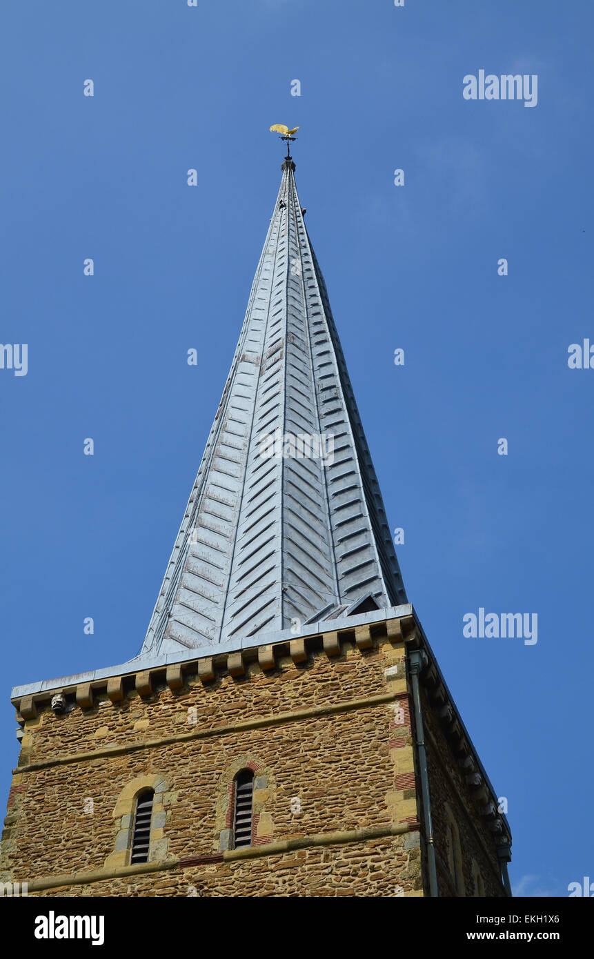 Church steeple with ornate lead covering in the Surrey village of ...