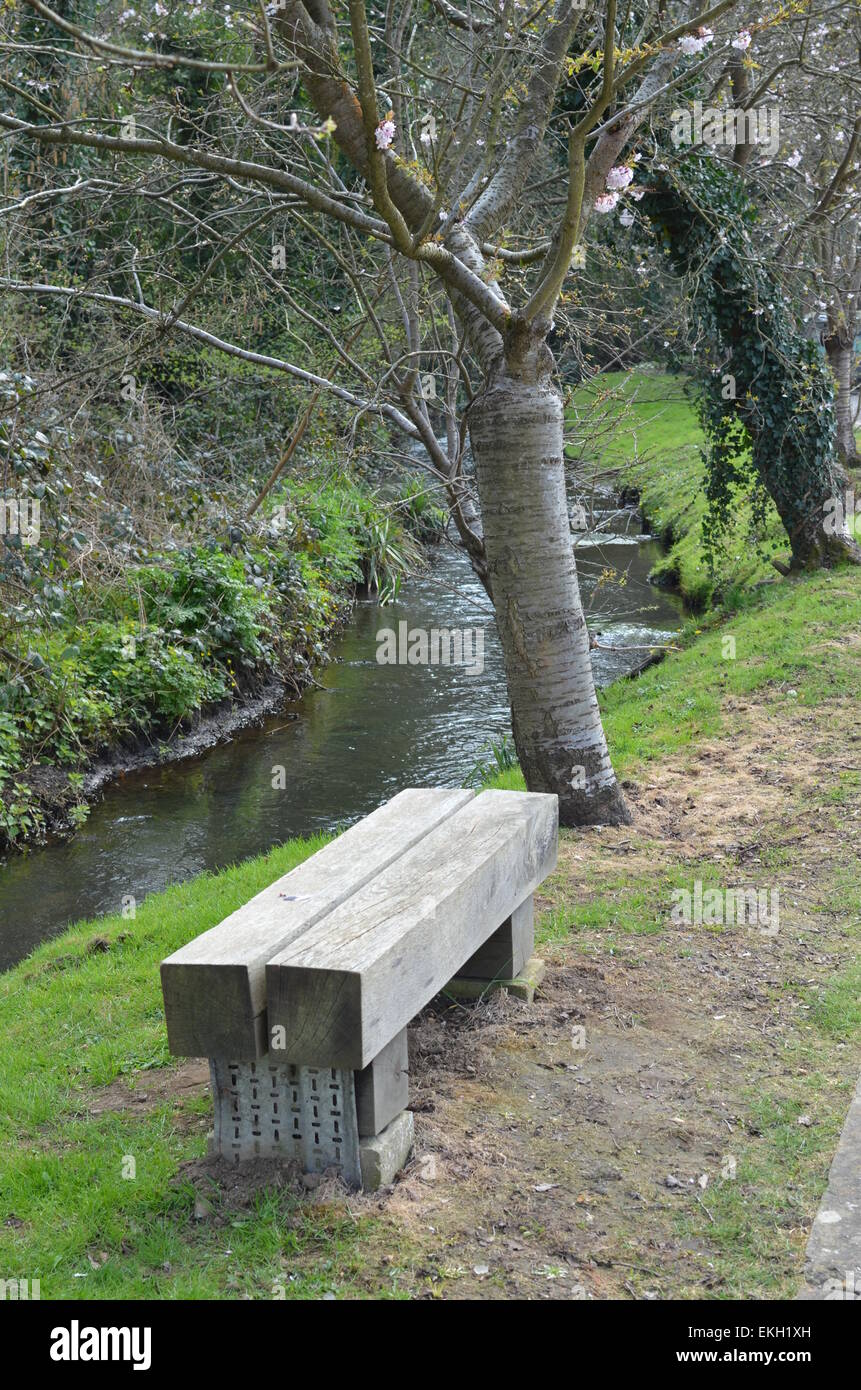 Wooden bench beside a stream in Surrey England Stock Photo - Alamy