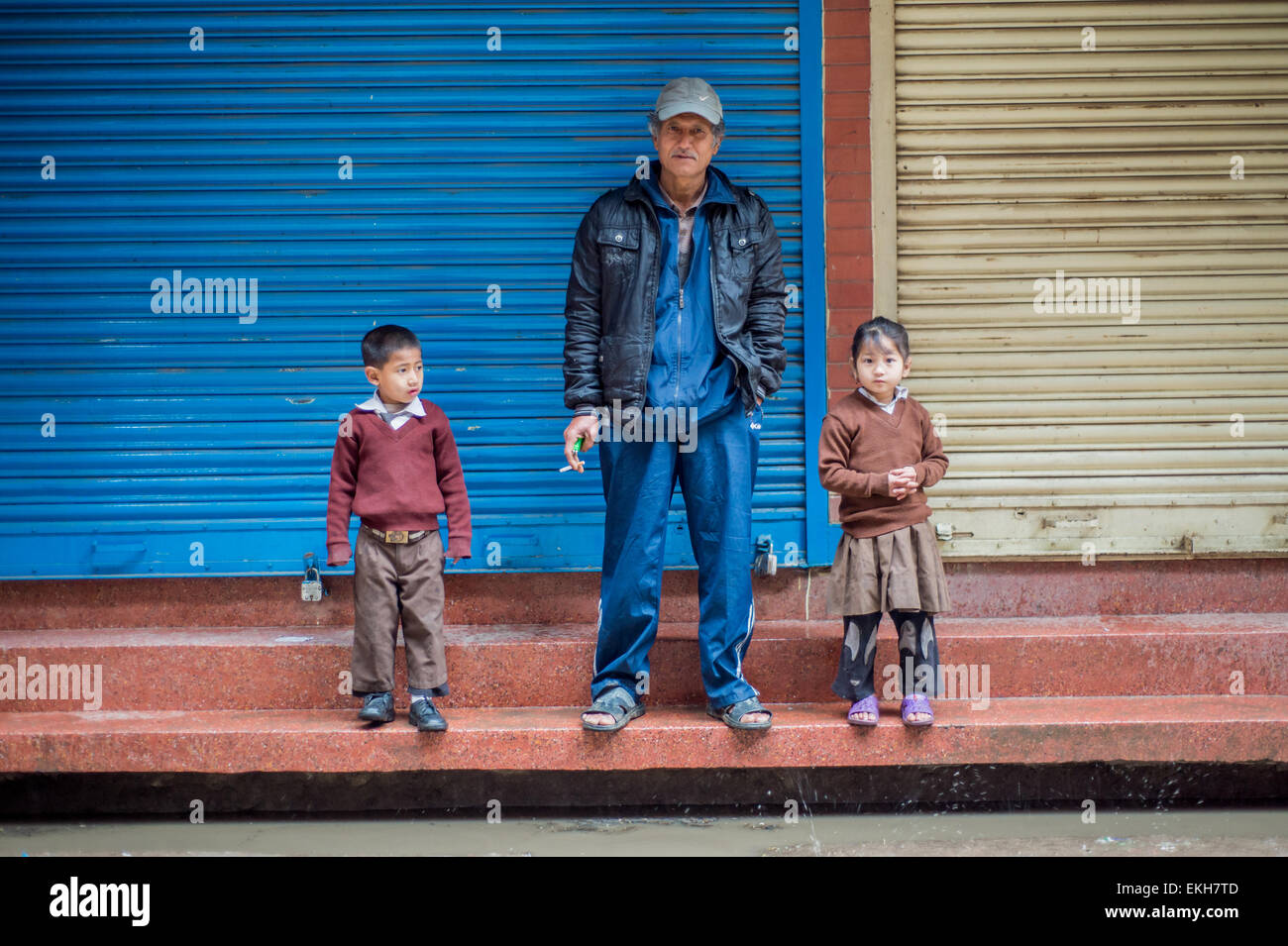 Portrait of a grand father and his two grand children in Kathmandu ...
