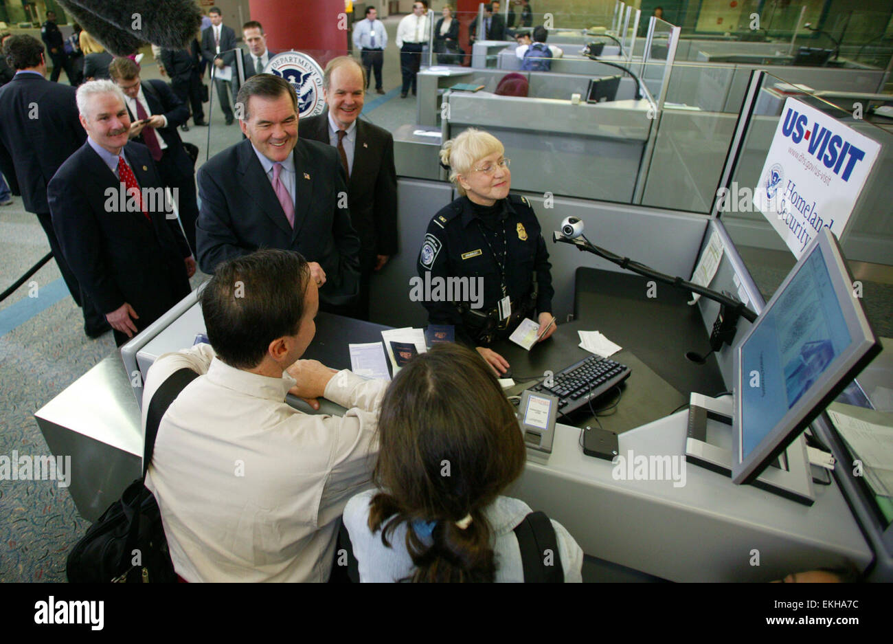 DHS Secretary Tom Ridge observed passengers being processed into ...