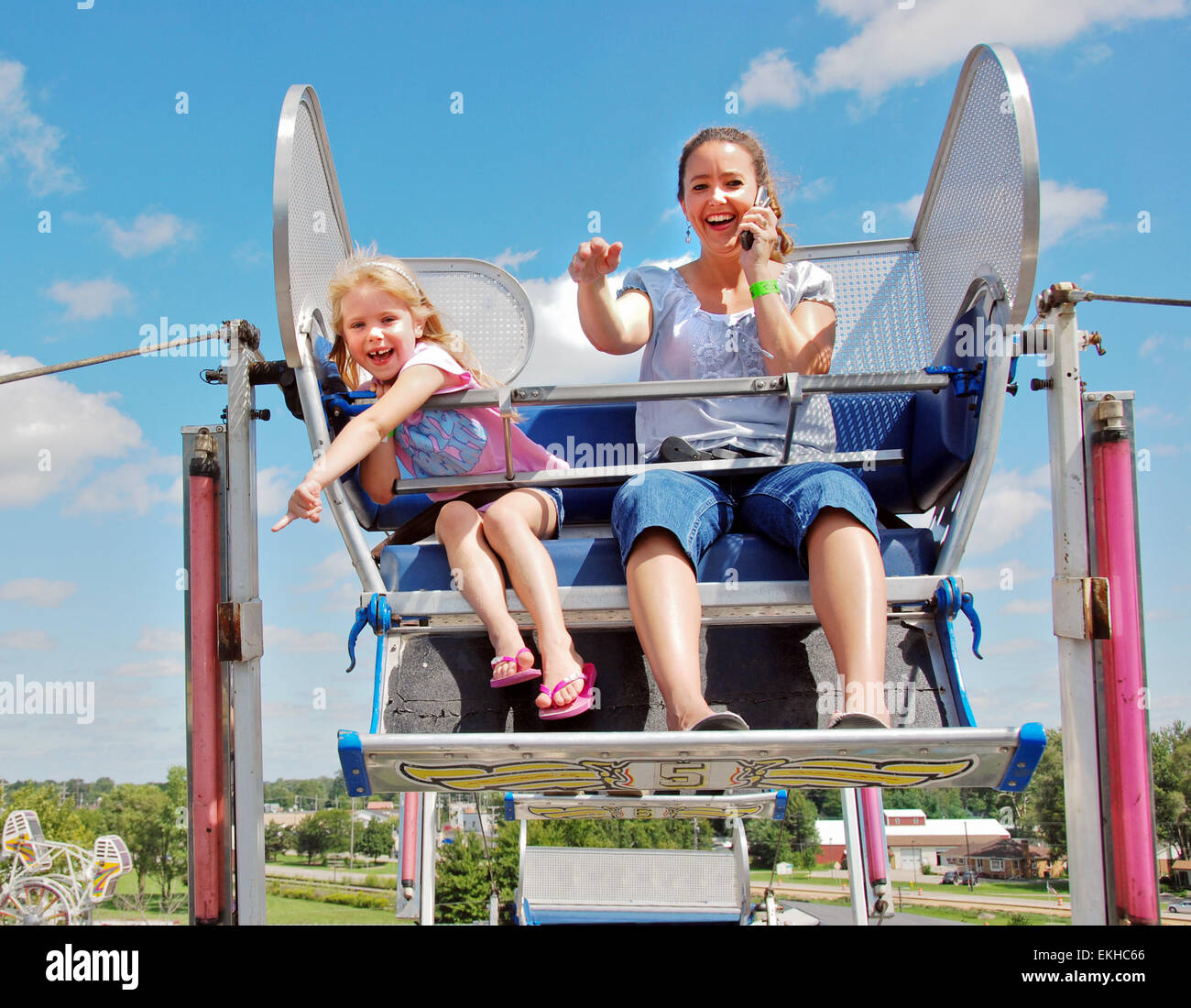 Kid girl ferris wheel riding hi-res stock photography and images - Alamy