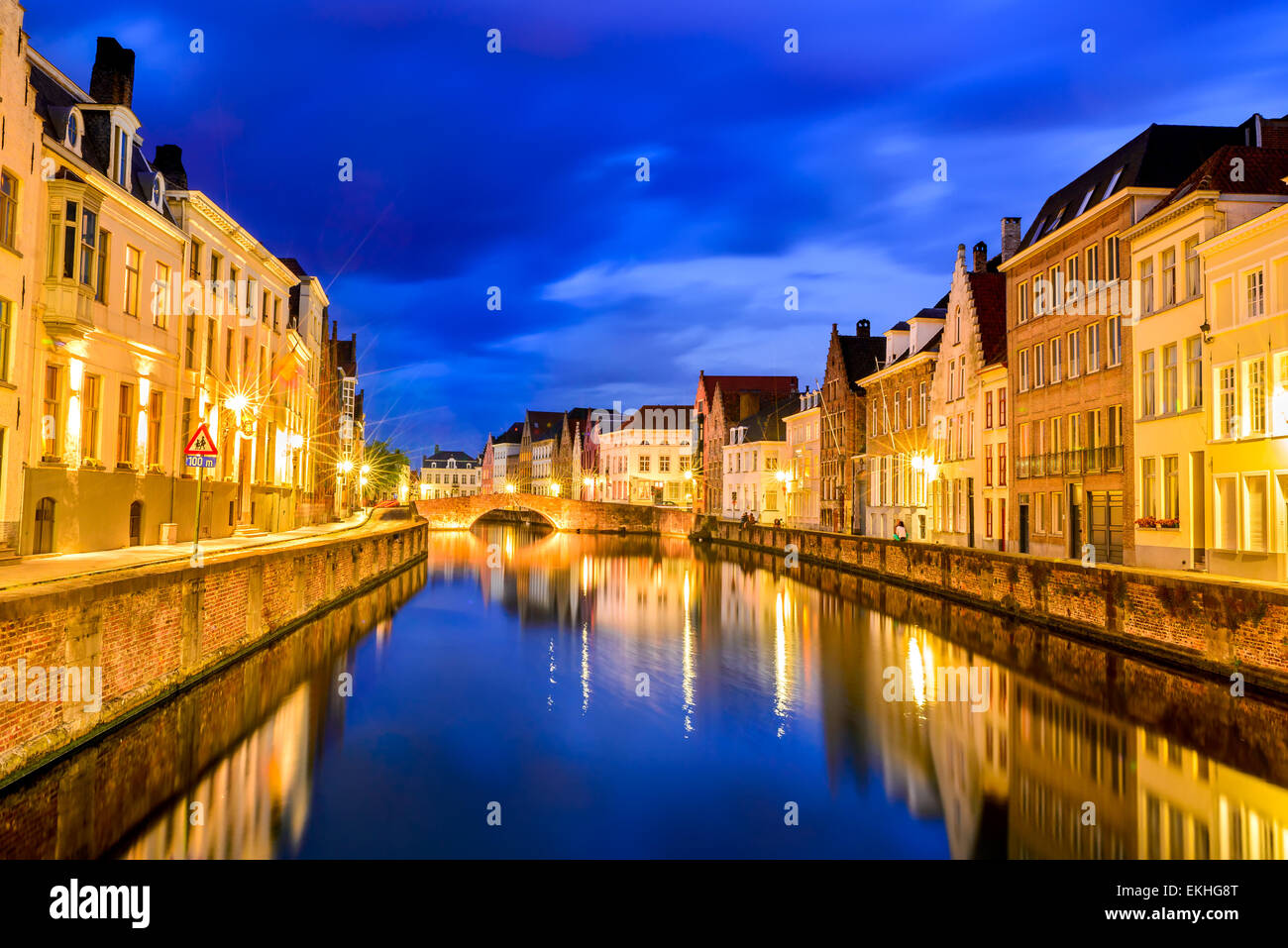 Bruges, Belgium. Night shot of historic medieval buildings along water ...