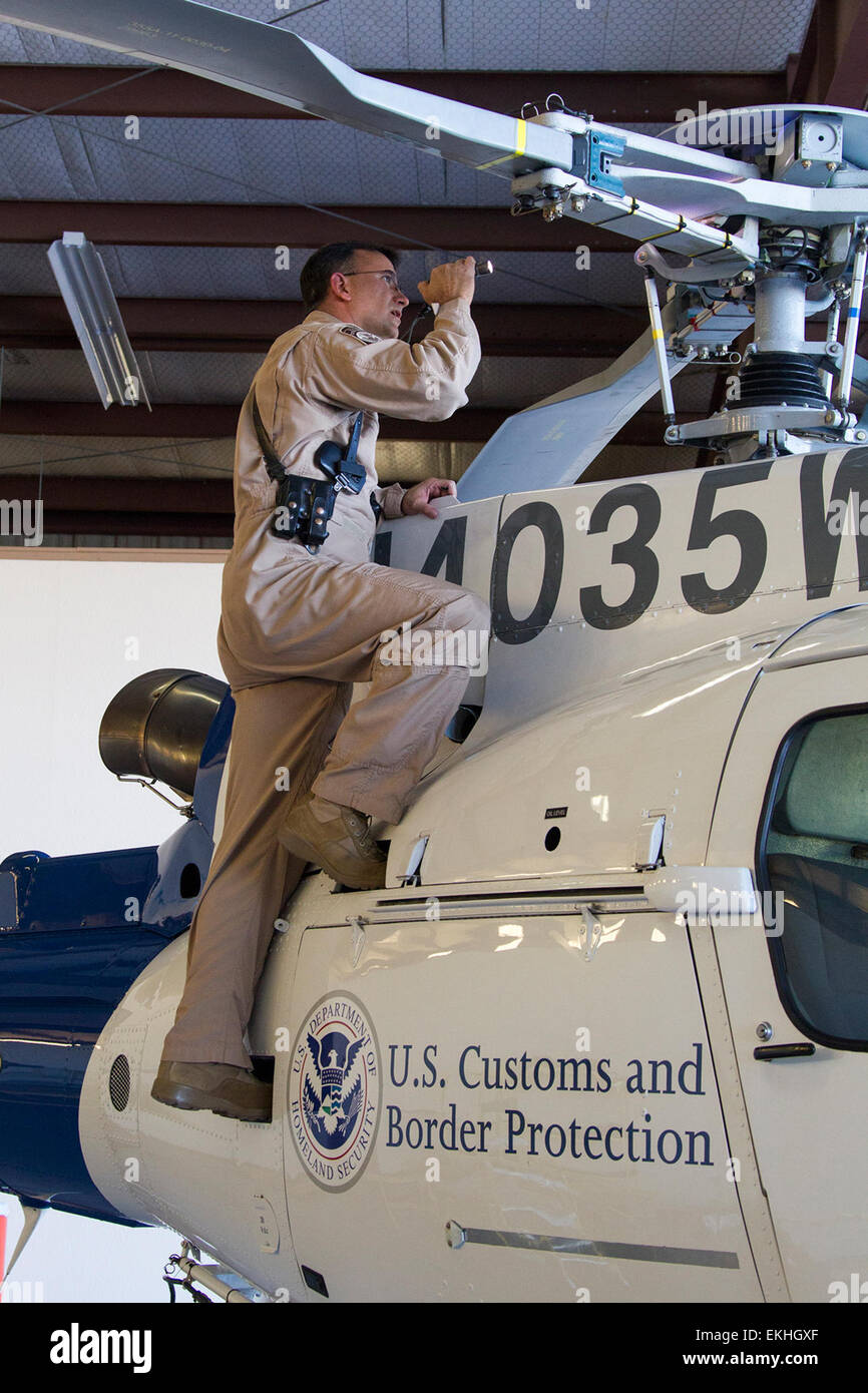 OAM Pilot Robert Smith performs pre-flight checks on an A-Star ...