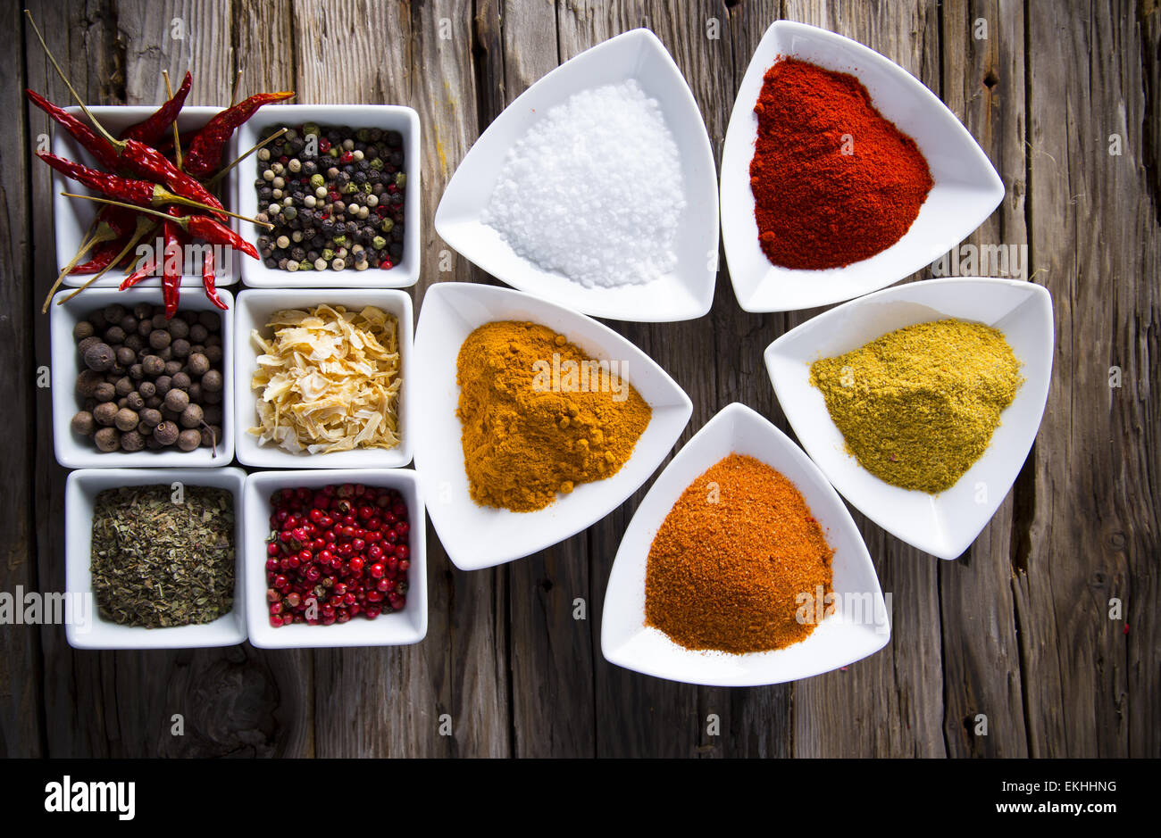 Assorted spices on wooden background Stock Photo - Alamy