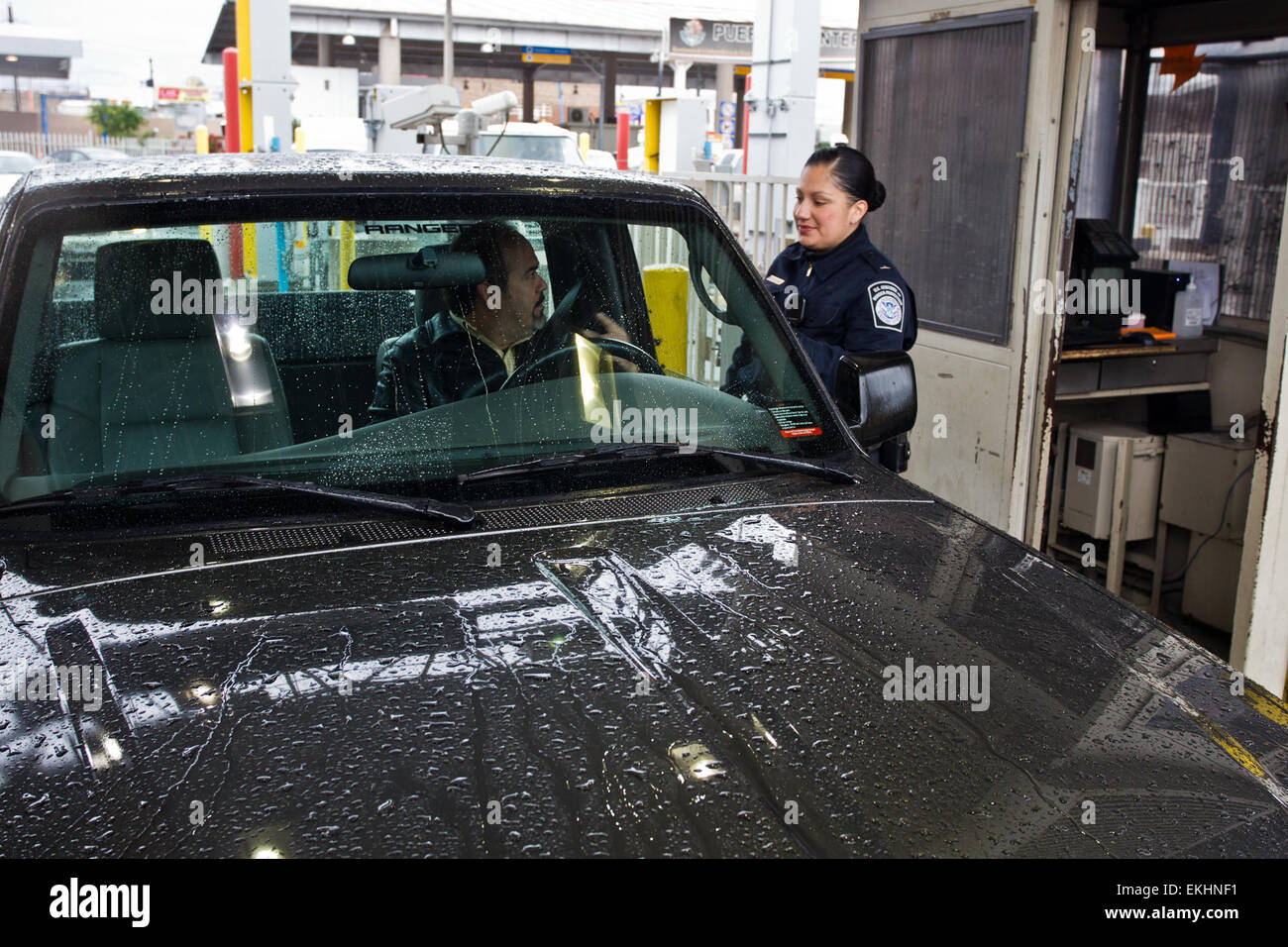A U.S. Customs and Border Protection Officer checks the documentation ...