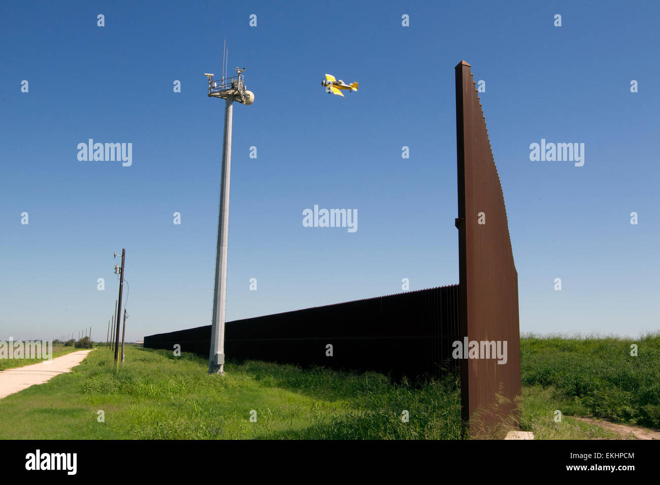 A remote surveillance camera captures the fence line along the South ...