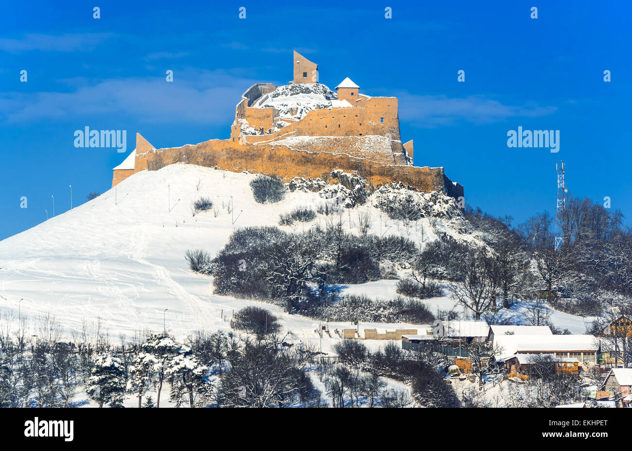 Transylvania, Romania. Winter scenery with ruins of Rupea Fortress ...