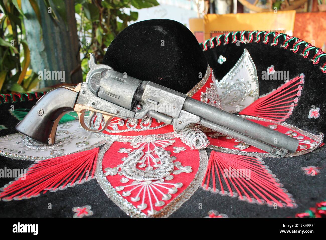 Cowboy cactus hat revolver hi-res stock photography and images - Alamy
