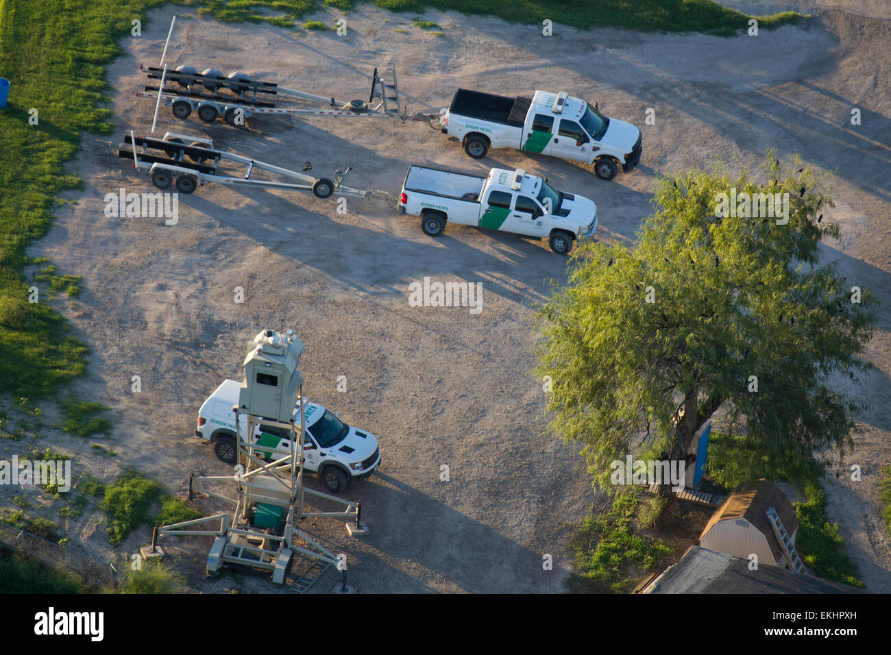 An aerial view of Border Patrol vehicles and a skybox in McAllen, South ...