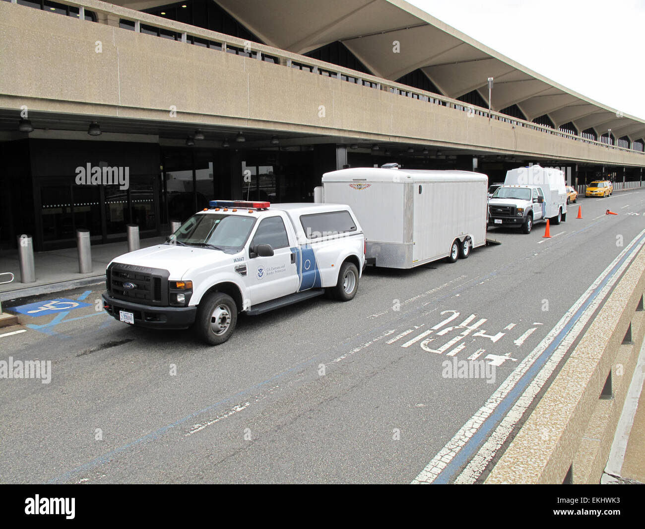 U.S. Customs and Border Protection vehicles were staged curbside at ...