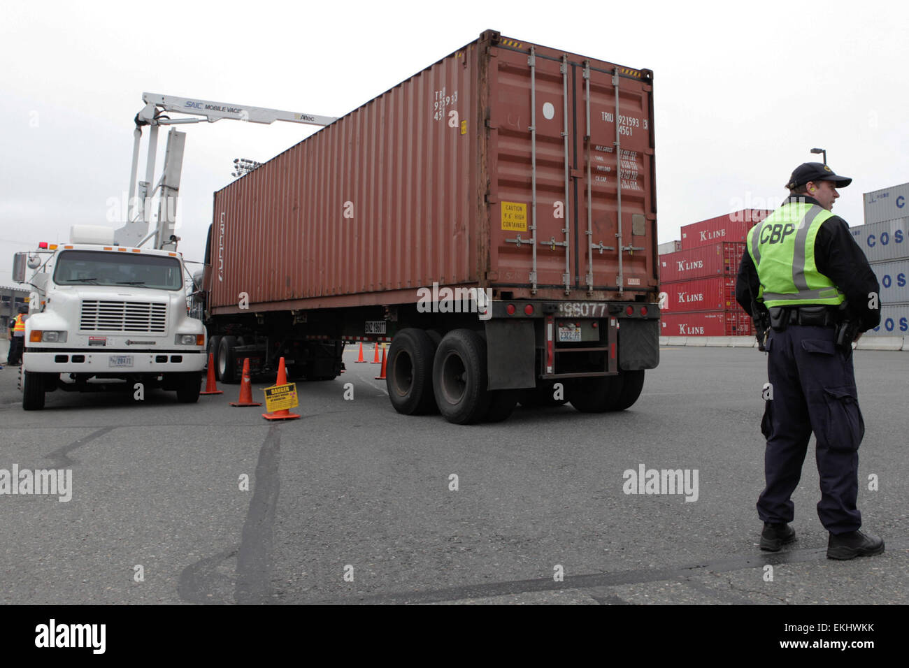 A U.S. Customs and Border Protection officer conducts a visual ...