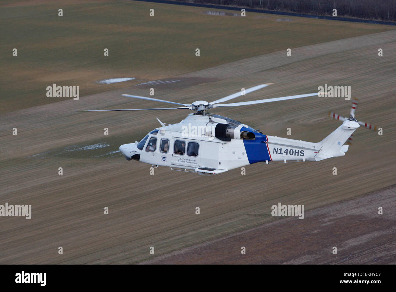 A U.S. Customs and Border Protection helicopter patrols an area in the ...