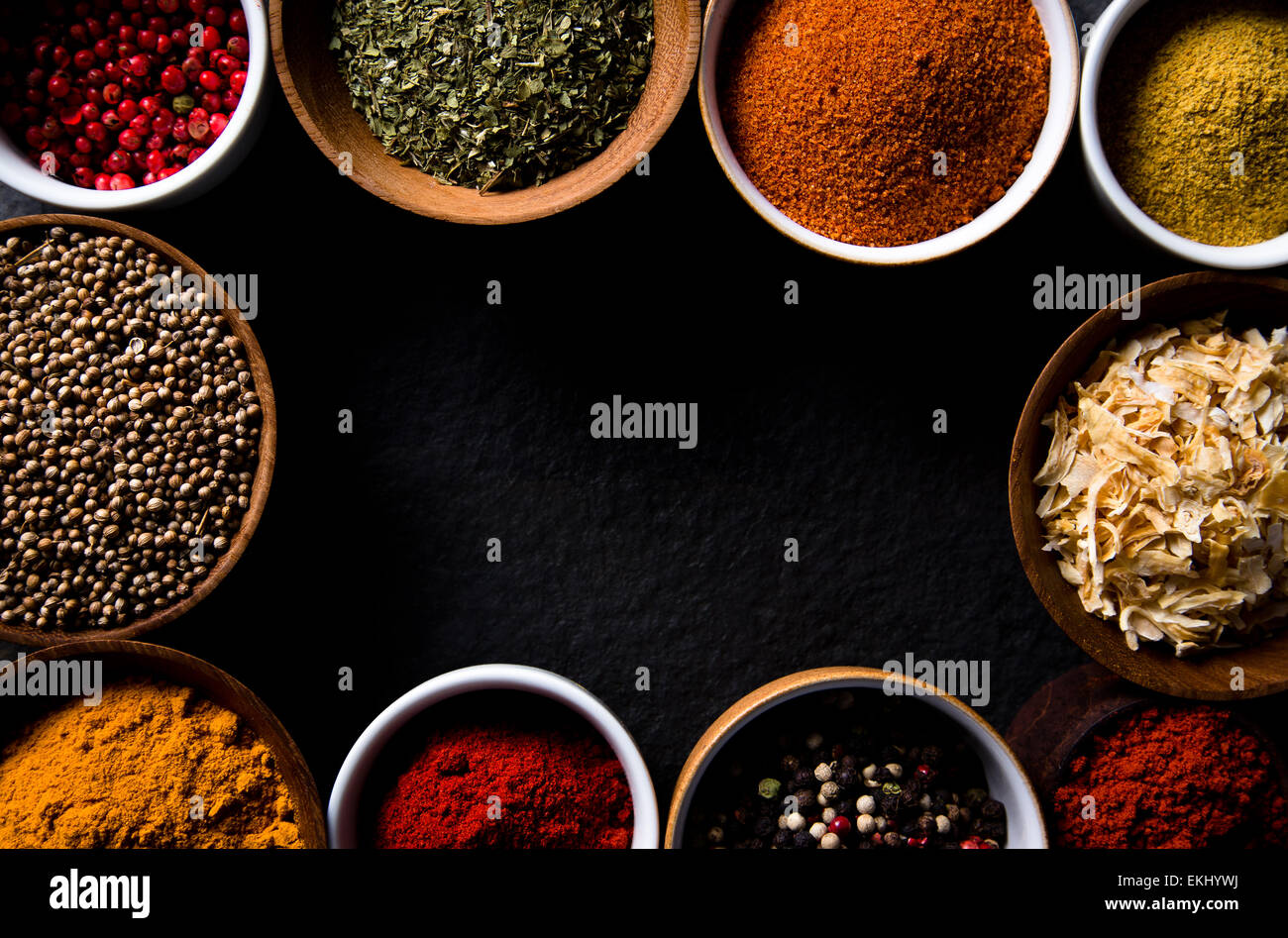 Assorted spices on stone background Stock Photo - Alamy