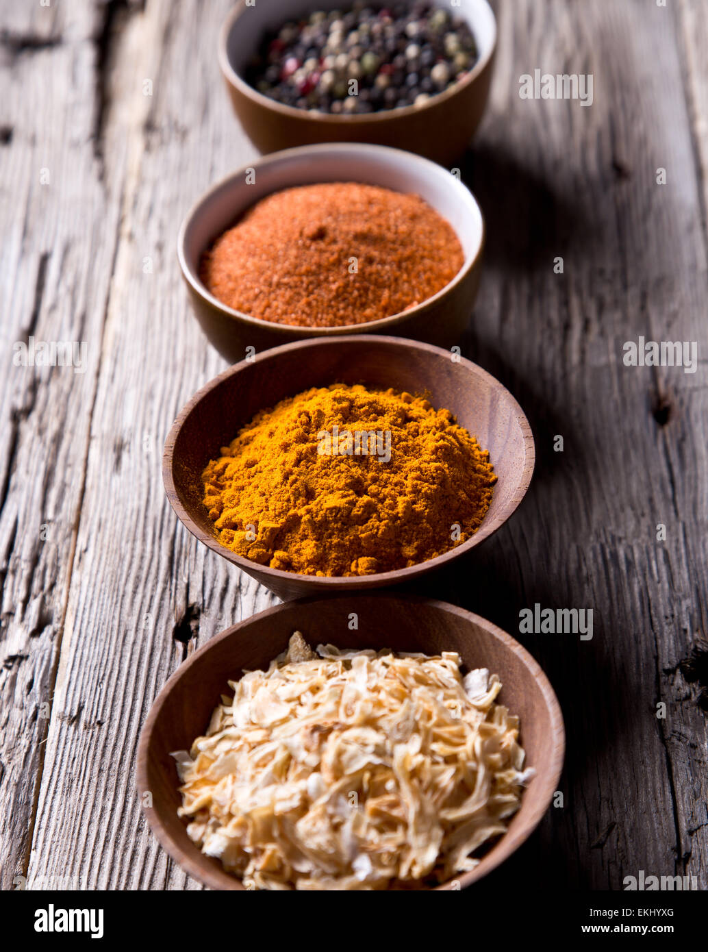 Assorted spices on wooden background Stock Photo - Alamy
