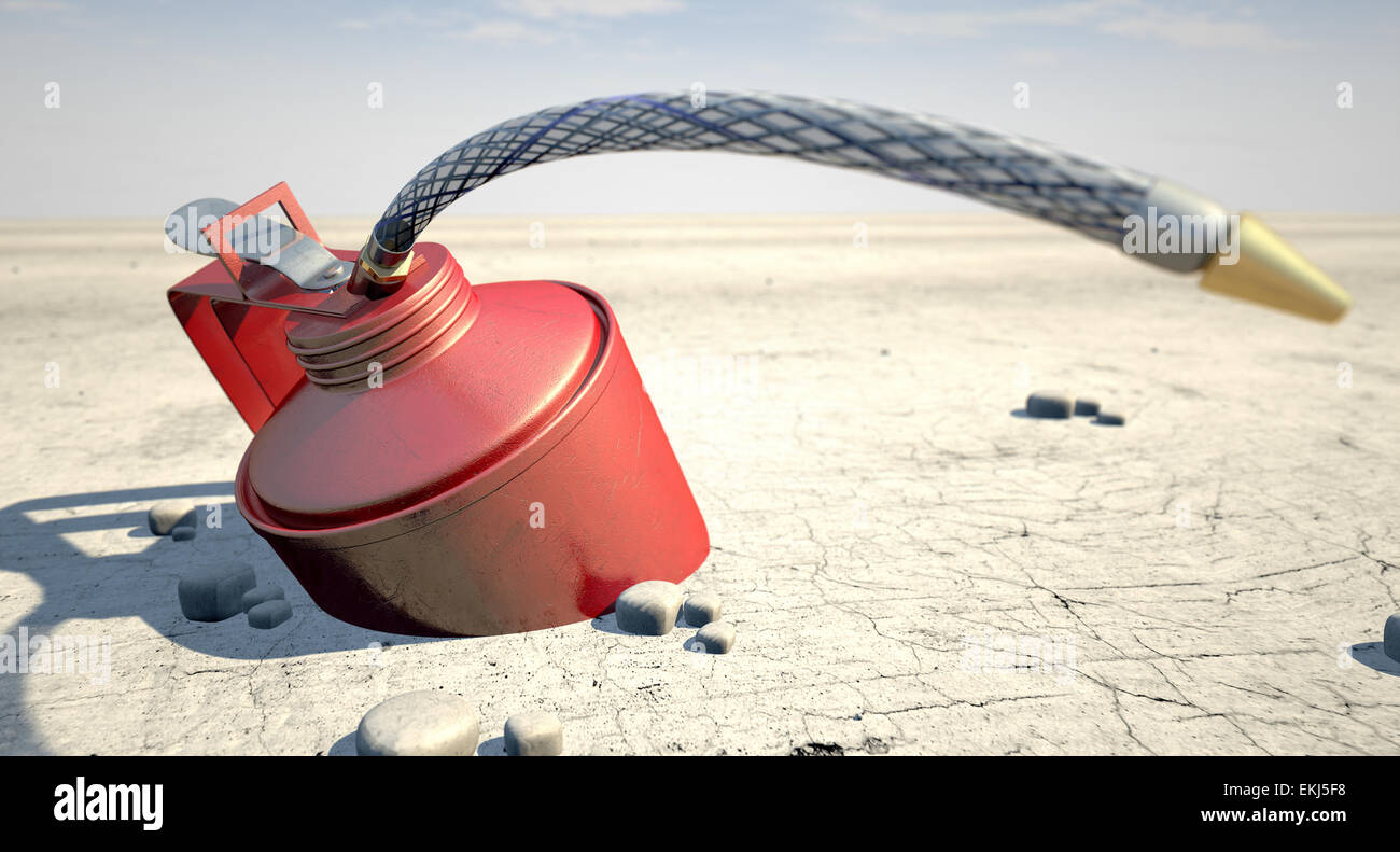A regular oil can lying desolate in an arid desert on a hot midday sun ...