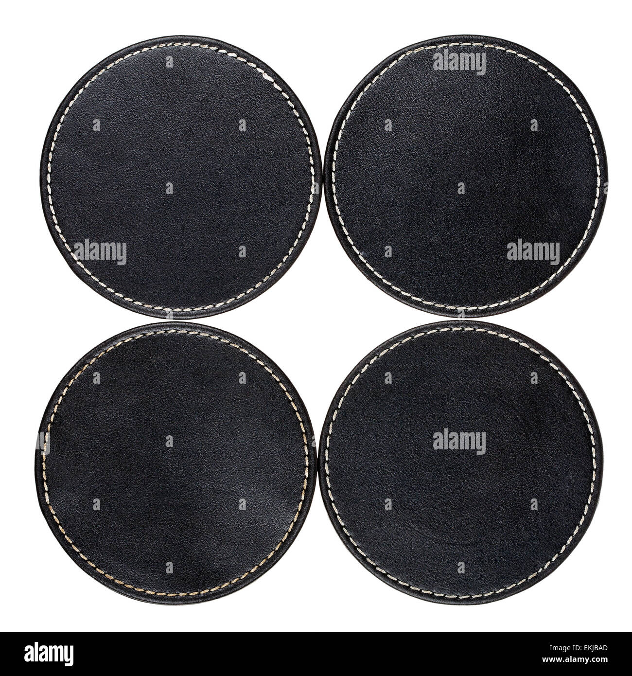 Round black leather table coasters isolated on white Stock Photo - Alamy