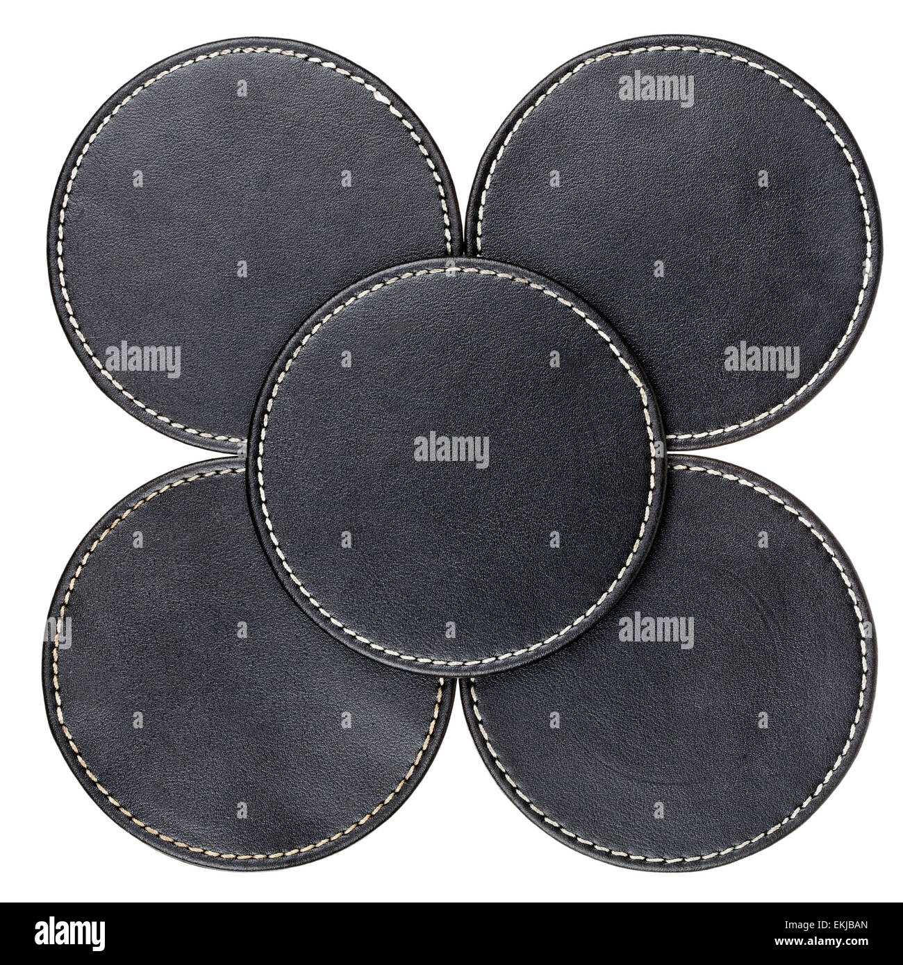 Round black leather table coasters isolated on white Stock Photo - Alamy