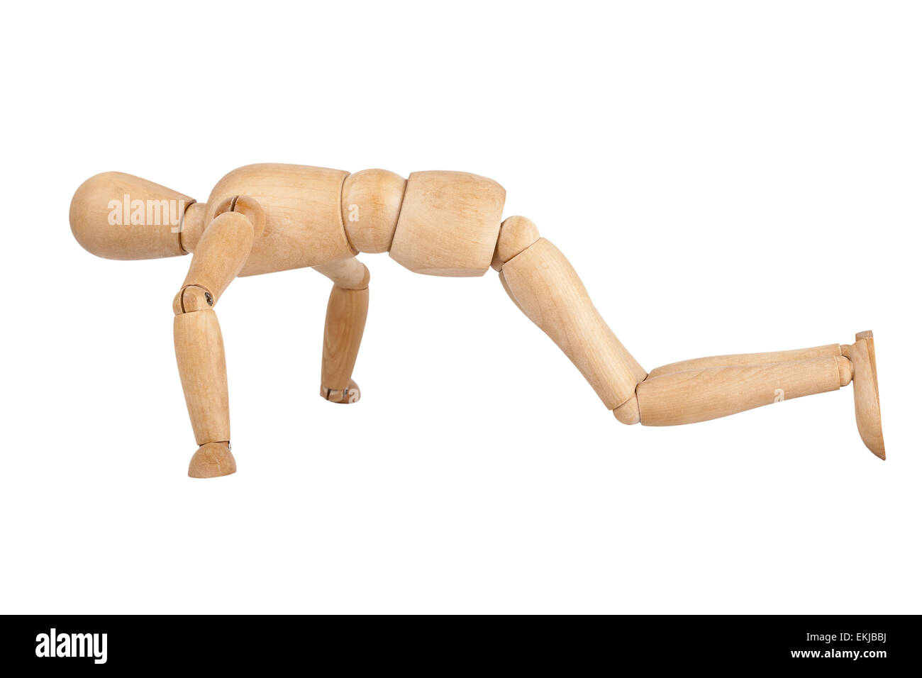 Wooden dummy doing push ups isolated on a white background Stock Photo ...