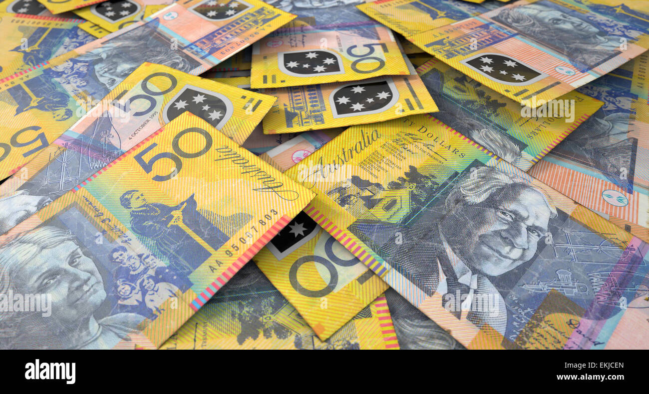 A macro close-up view of a messy scattered pile of australian dollar ...