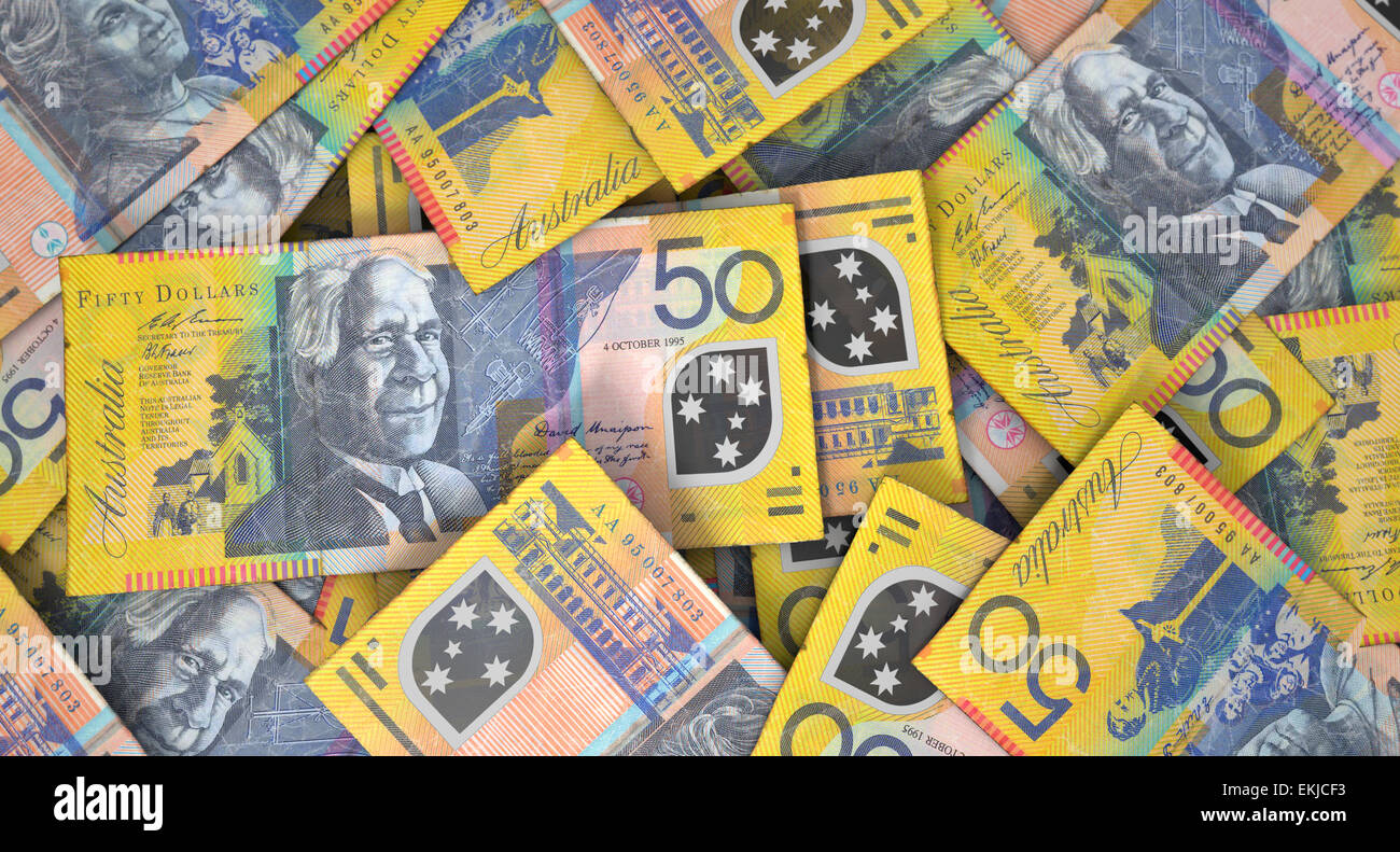 A macro close-up view of a messy scattered pile of australian dollar ...