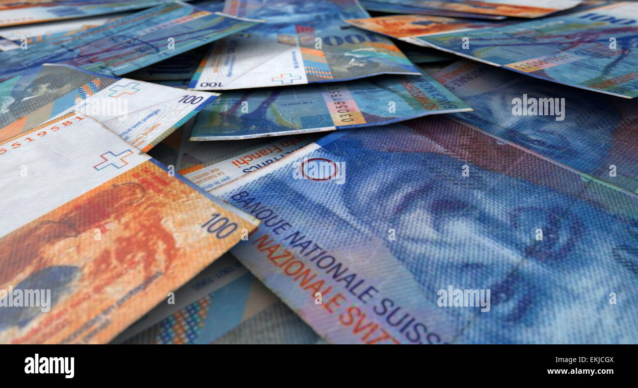 A macro close-up view of a messy scattered pile of swiss franc ...