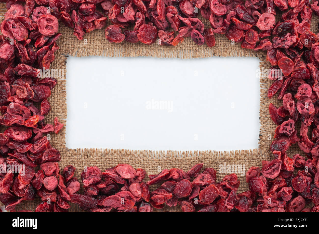 Frame made of burlap with dried cranberry, on a white background Stock ...