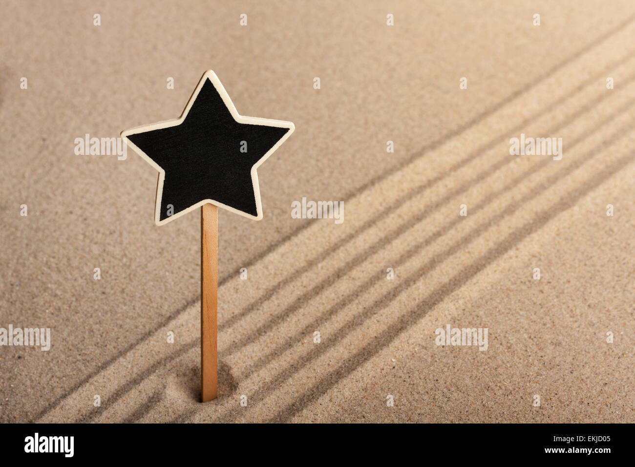 Pointer star standing in the sand, can be used as background Stock ...