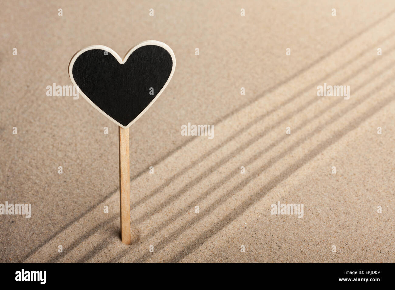 Pointer heart standing in the sand, can be used as background Stock ...