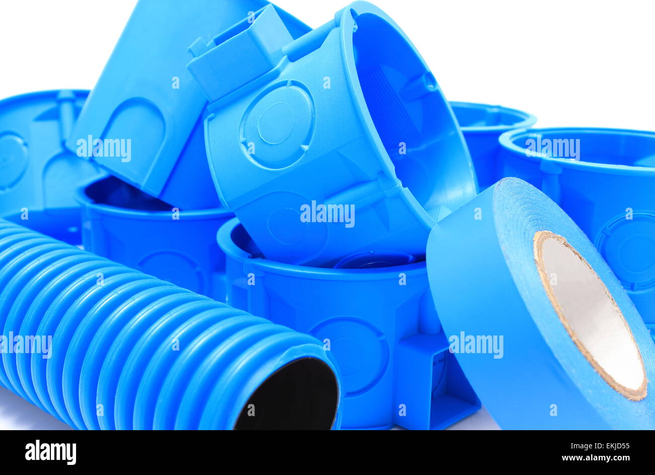 Heap of blue electrical boxes and components for use in electrical ...