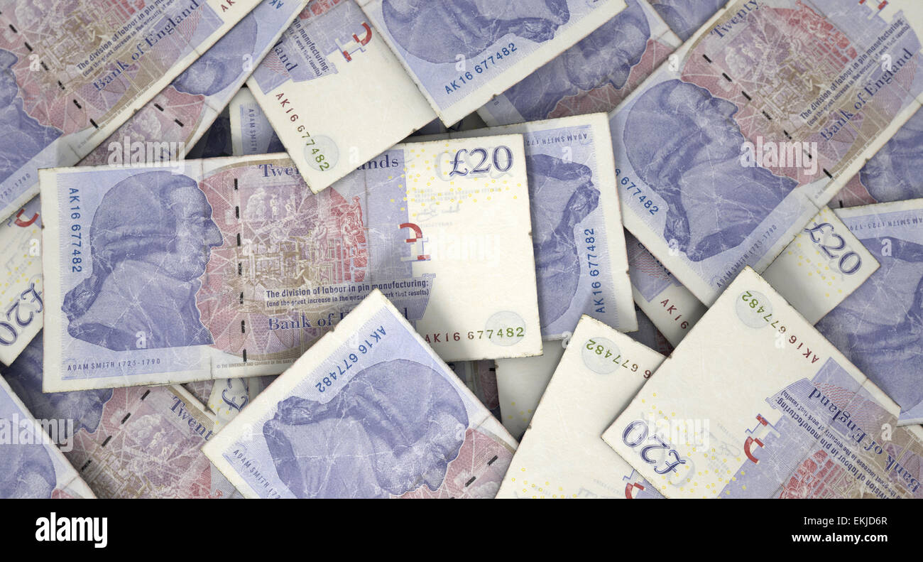 A macro close-up view of a messy scattered pile of british pound ...