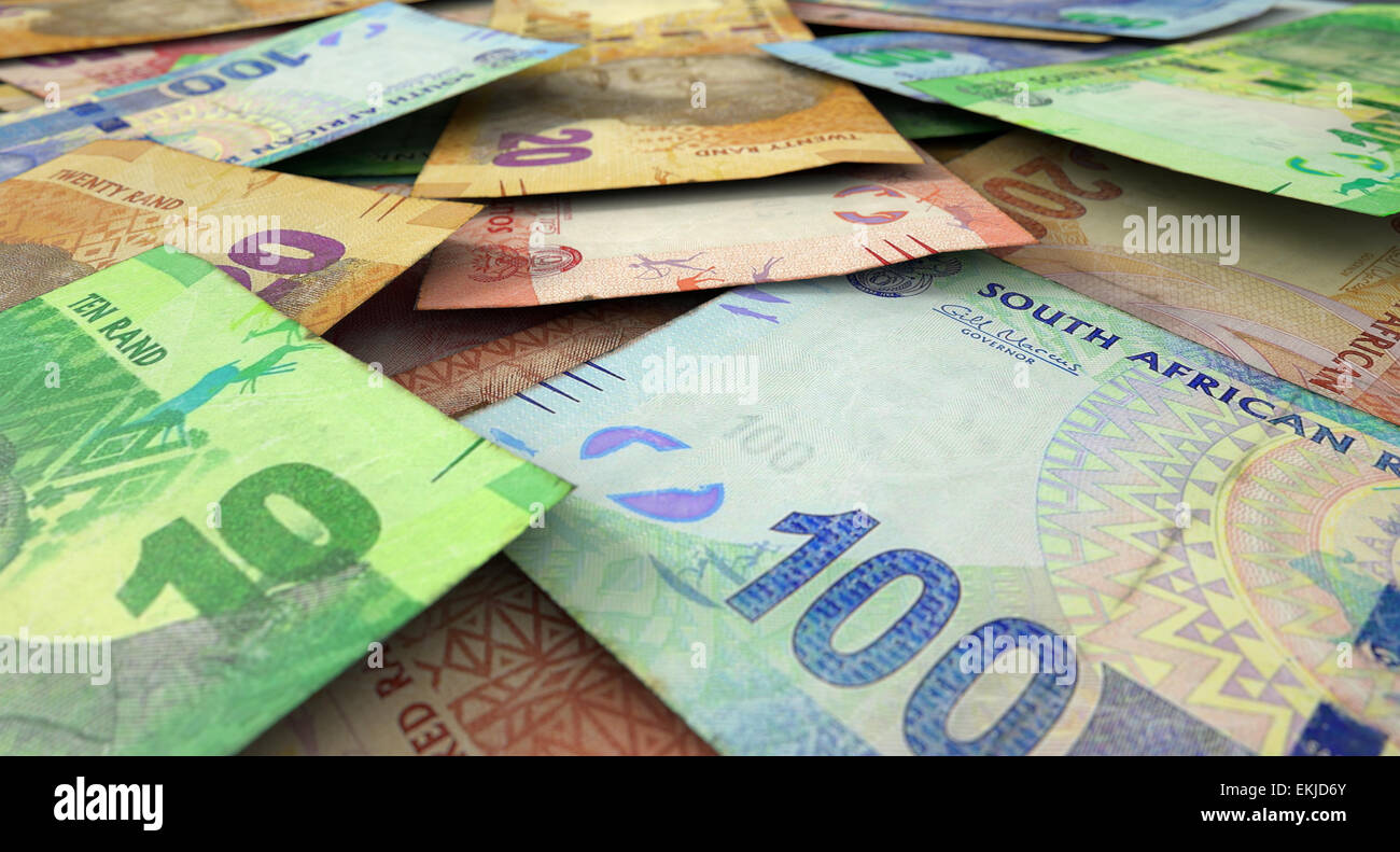 A macro close-up view of a messy scattered pile of south african rand ...