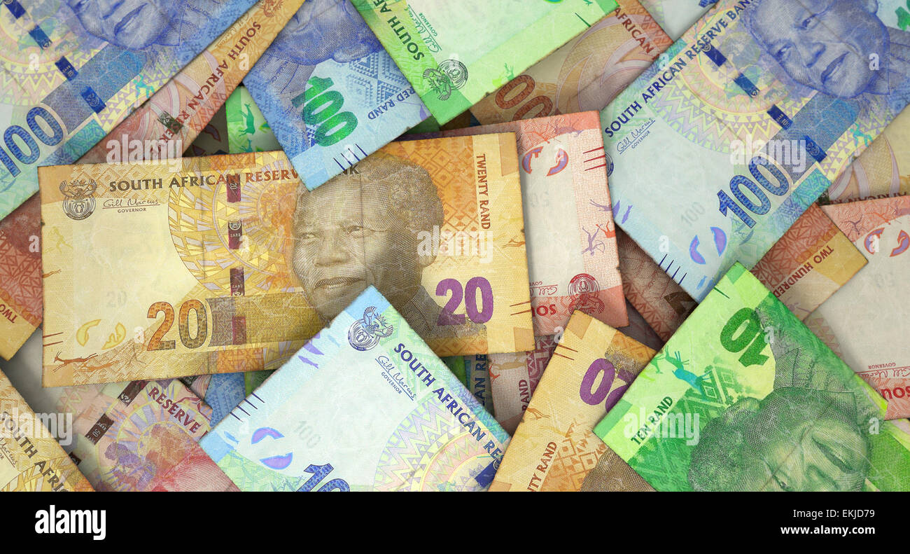 A macro close-up view of a messy scattered pile of south african rand ...