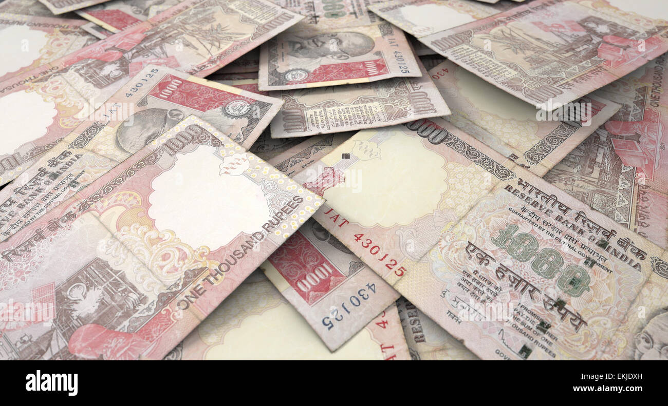 A macro close-up view of a messy scattered pile of indian rupee ...