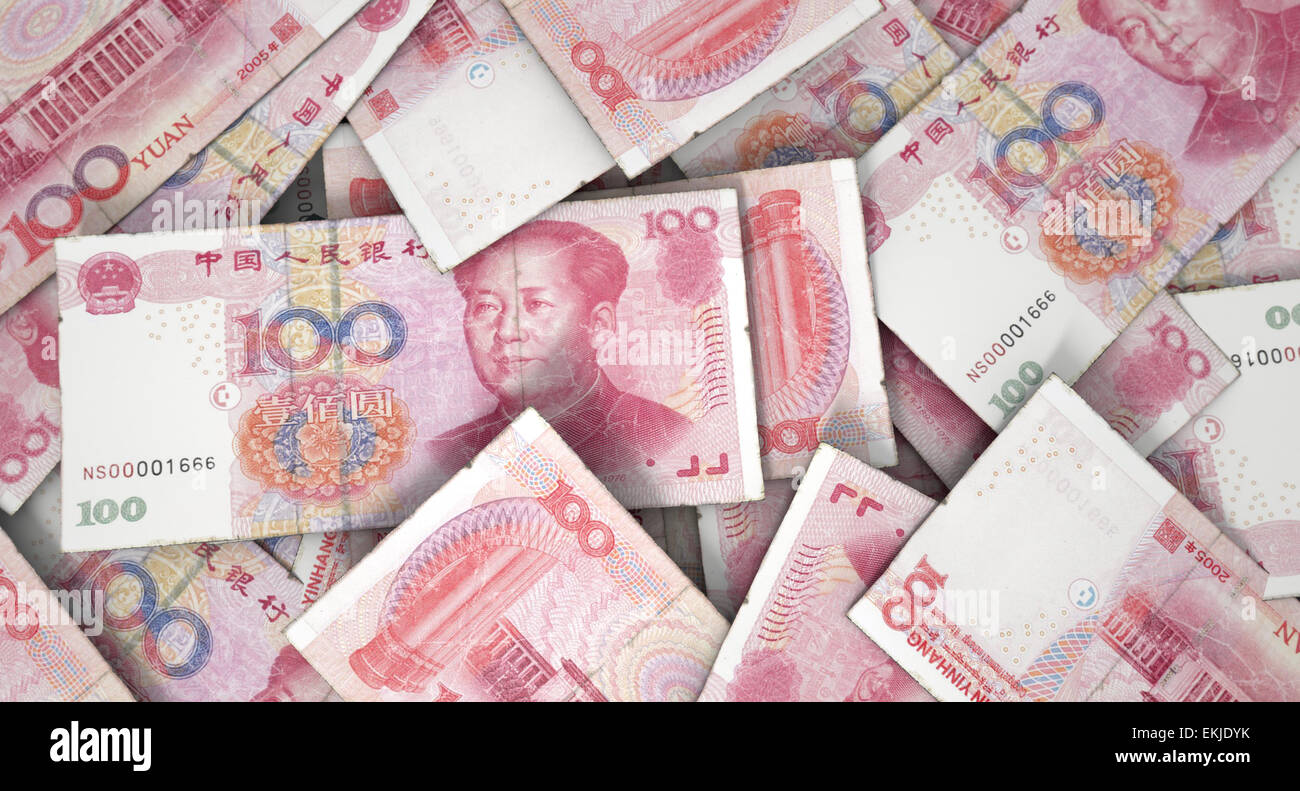 A macro close-up view of a messy scattered pile of chinese yuan ...