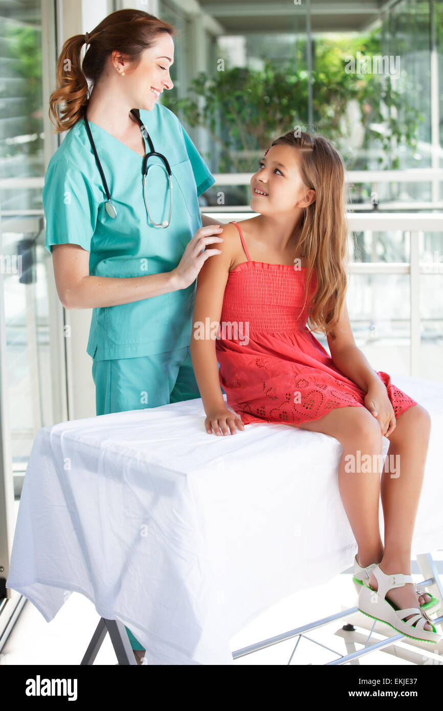 Pediatrician with her patient Stock Photo - Alamy