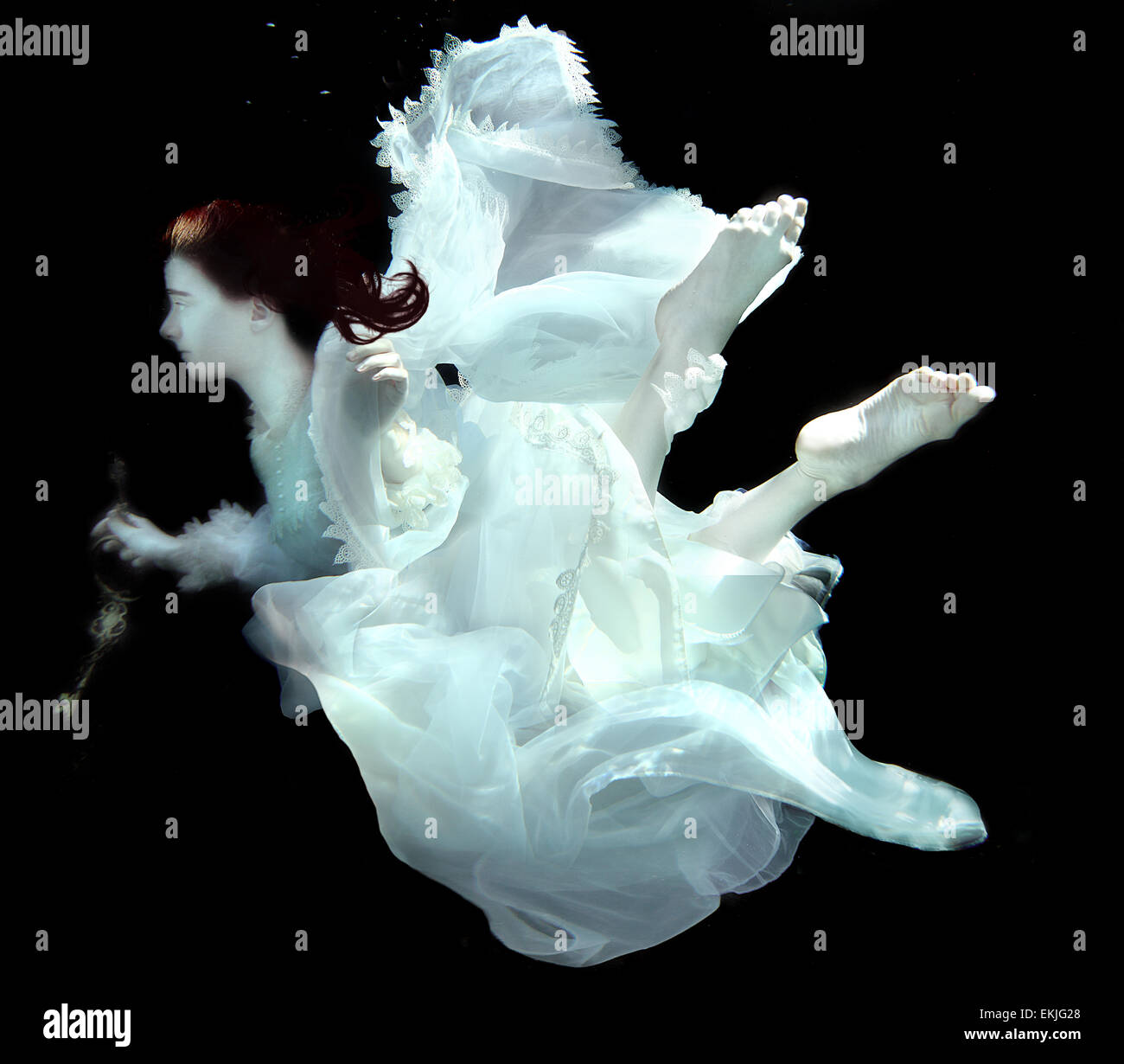 Floating Woman Underwater Wearing White Gown Stock Photo - Alamy