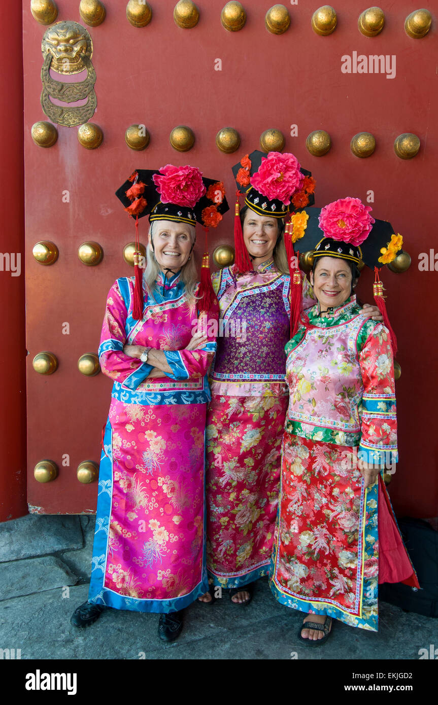 Western tourists dress in costumes and pose for photographs at the ...