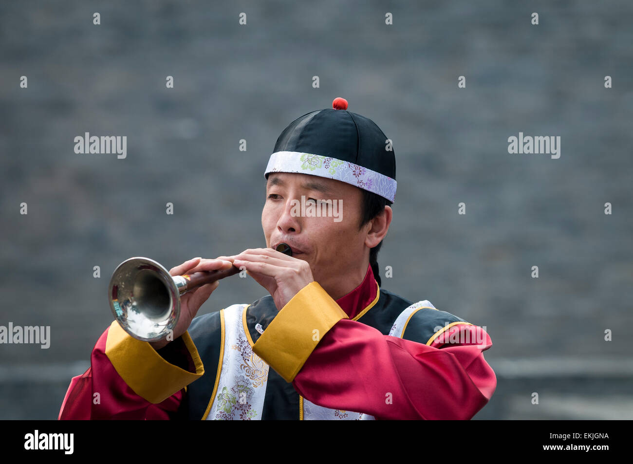 Costumed performers play music in the ancient walled city of Pingyao ...
