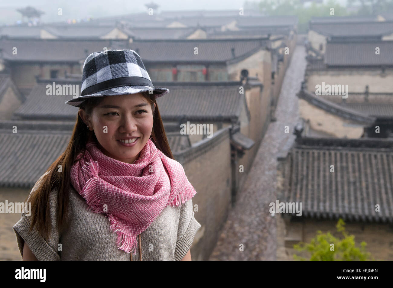 Chinese tourists brave rain at the Wang Family Courtyard Home, Linshi ...