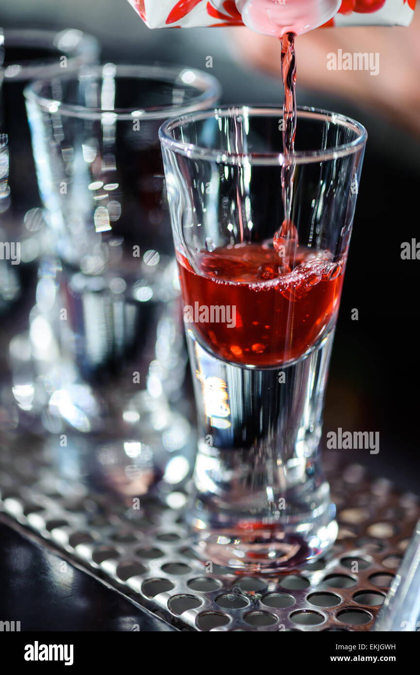 Barman makes shots in a bar Stock Photo - Alamy